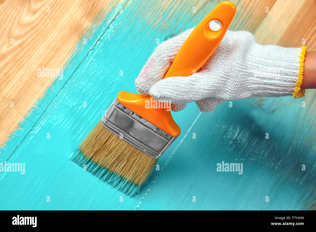 Closeup hand worker painting blue hi-res stock photography and images ...