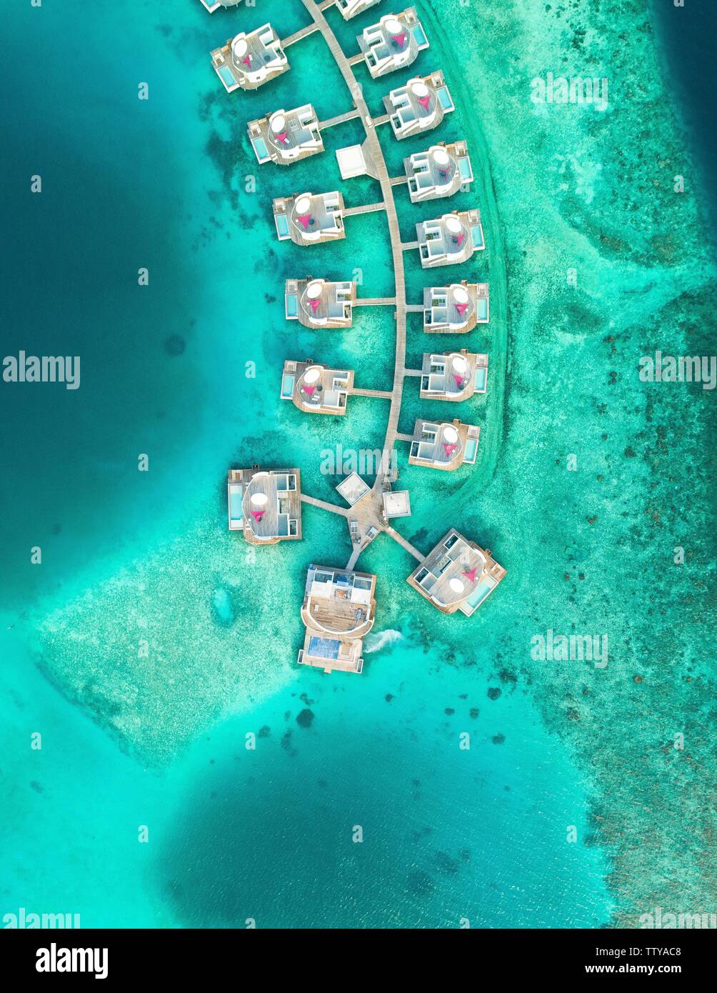 Aerial shot of houses built over the sea in the Maldives Islands Stock ...