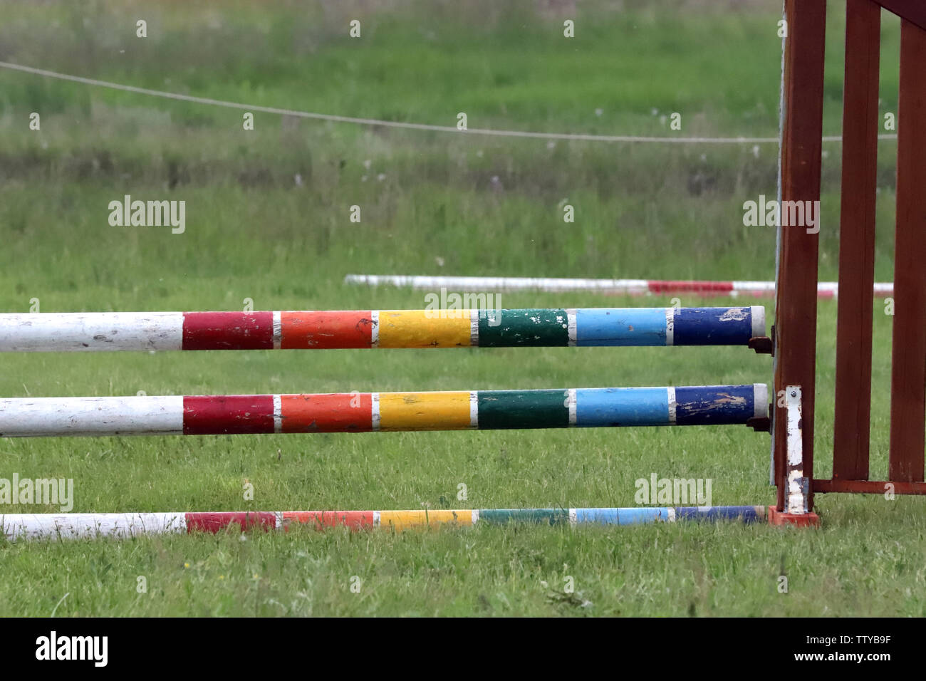 Image of show jumping poles on the training field. Wooden barriers for ...