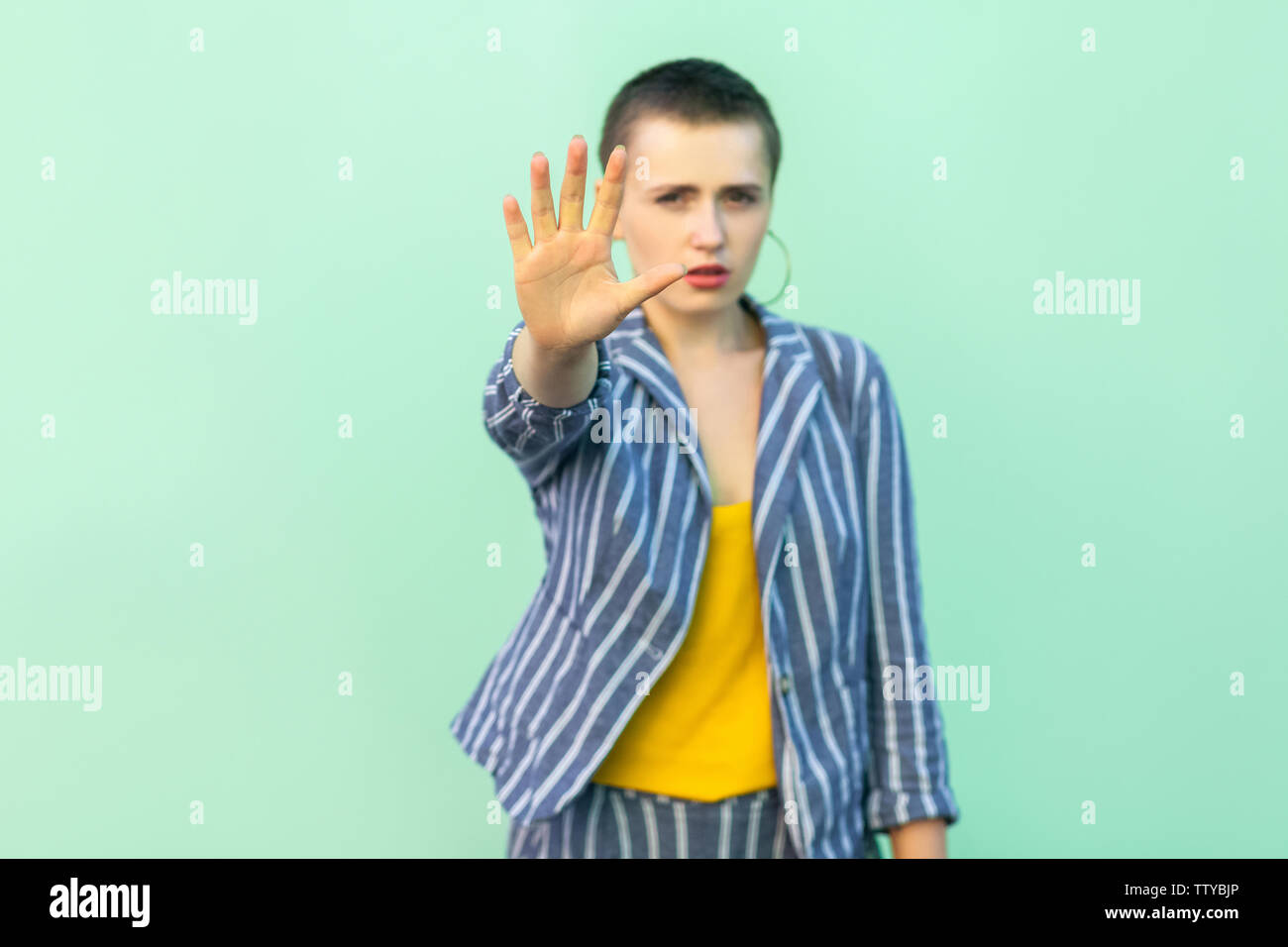 Stop. Portrait of serious handsome beautiful short hair young stylish ...