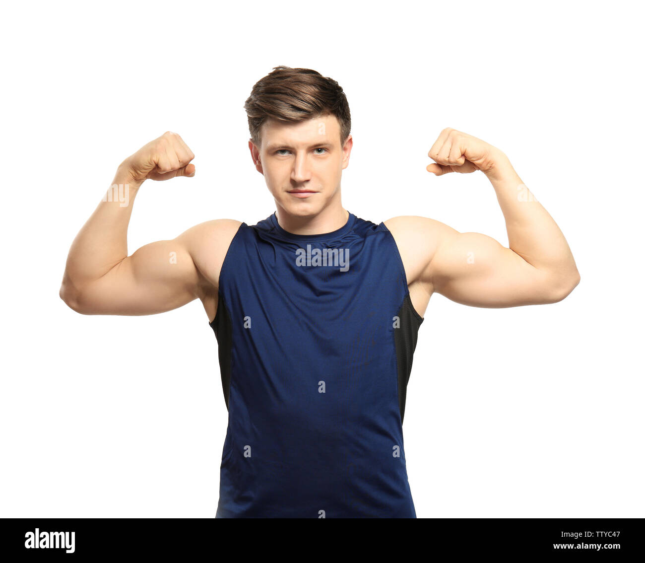 Young handsome sportsman on white background Stock Photo - Alamy