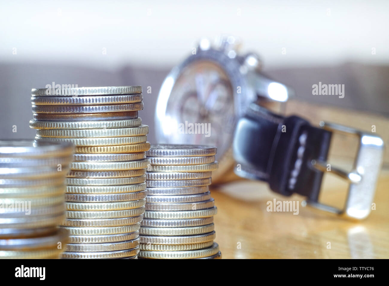 The concept of time is money. Money in front of clock in Business, time ...