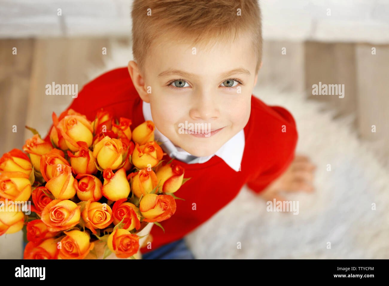 Cute boy with bouquet of beautiful flowers, close up Stock Photo - Alamy