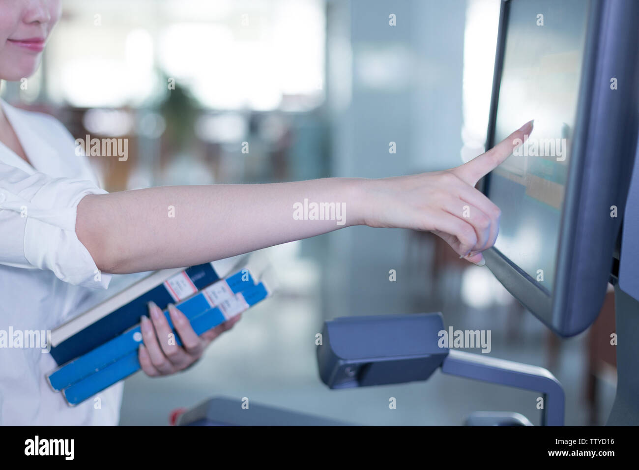 Beautiful asian student finger click screen and check book data Stock ...