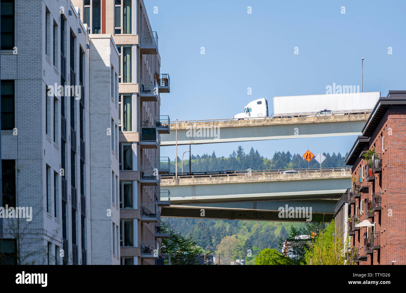 Side view of white big rig long haul semi truck transporting commercial ...