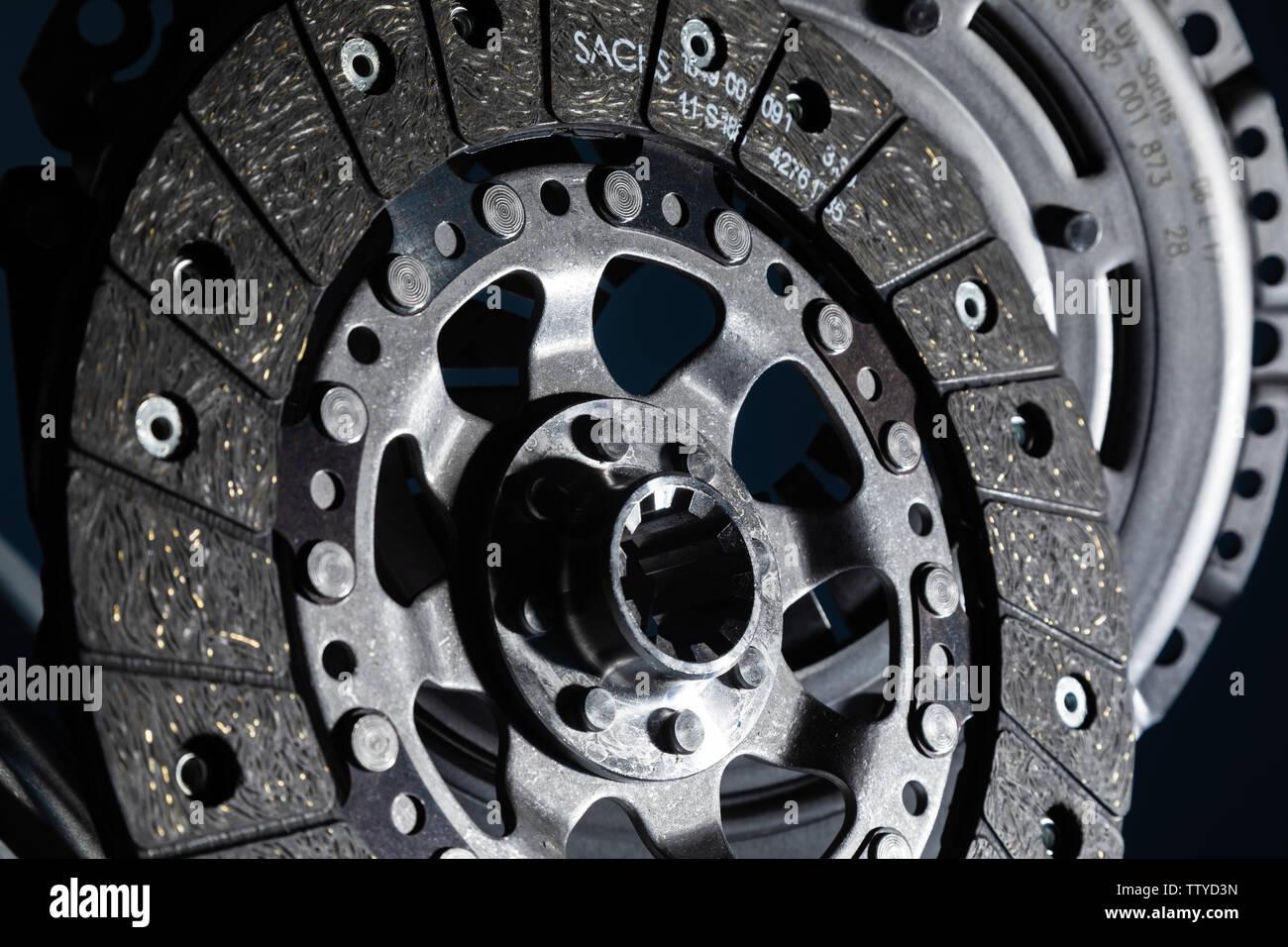 Shot of modern new spare parts for car in the muffled lighting made ...