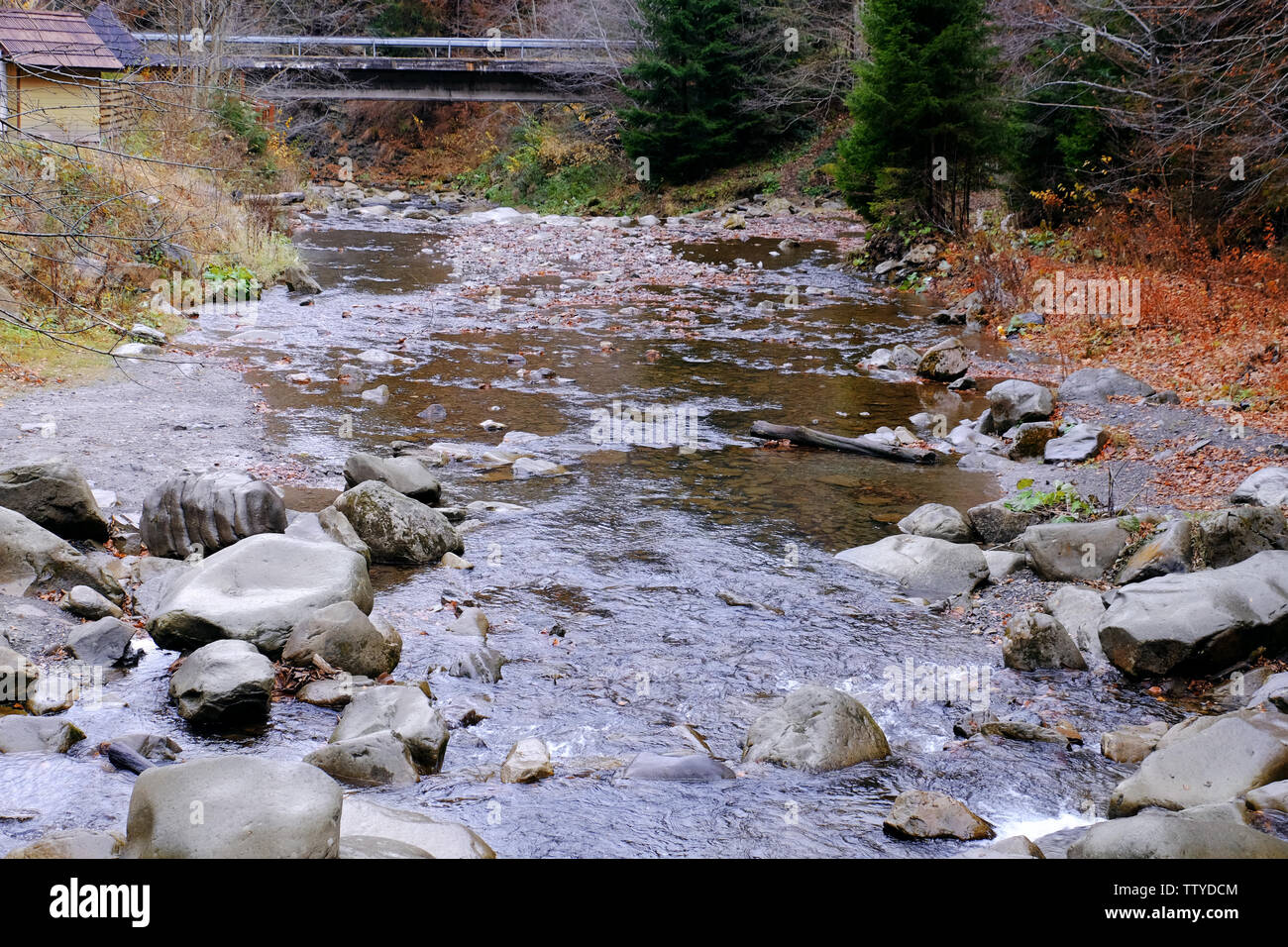 Stream flowing through rocky path in mountains Stock Photo - Alamy