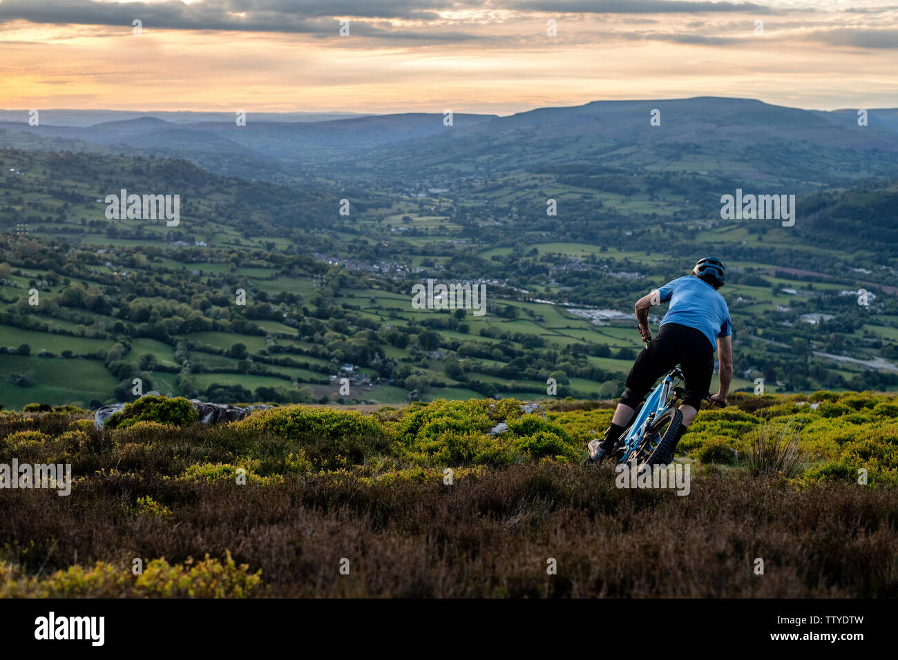 A man rides an ebike from the summit of The Blorenge in the Brecon ...