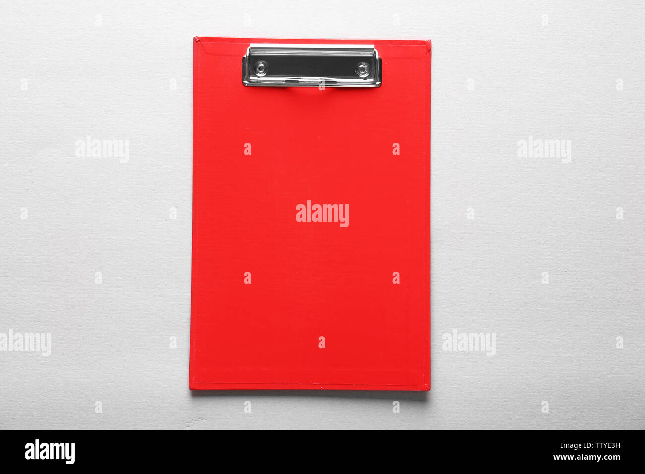 Red clipboard on light background Stock Photo - Alamy