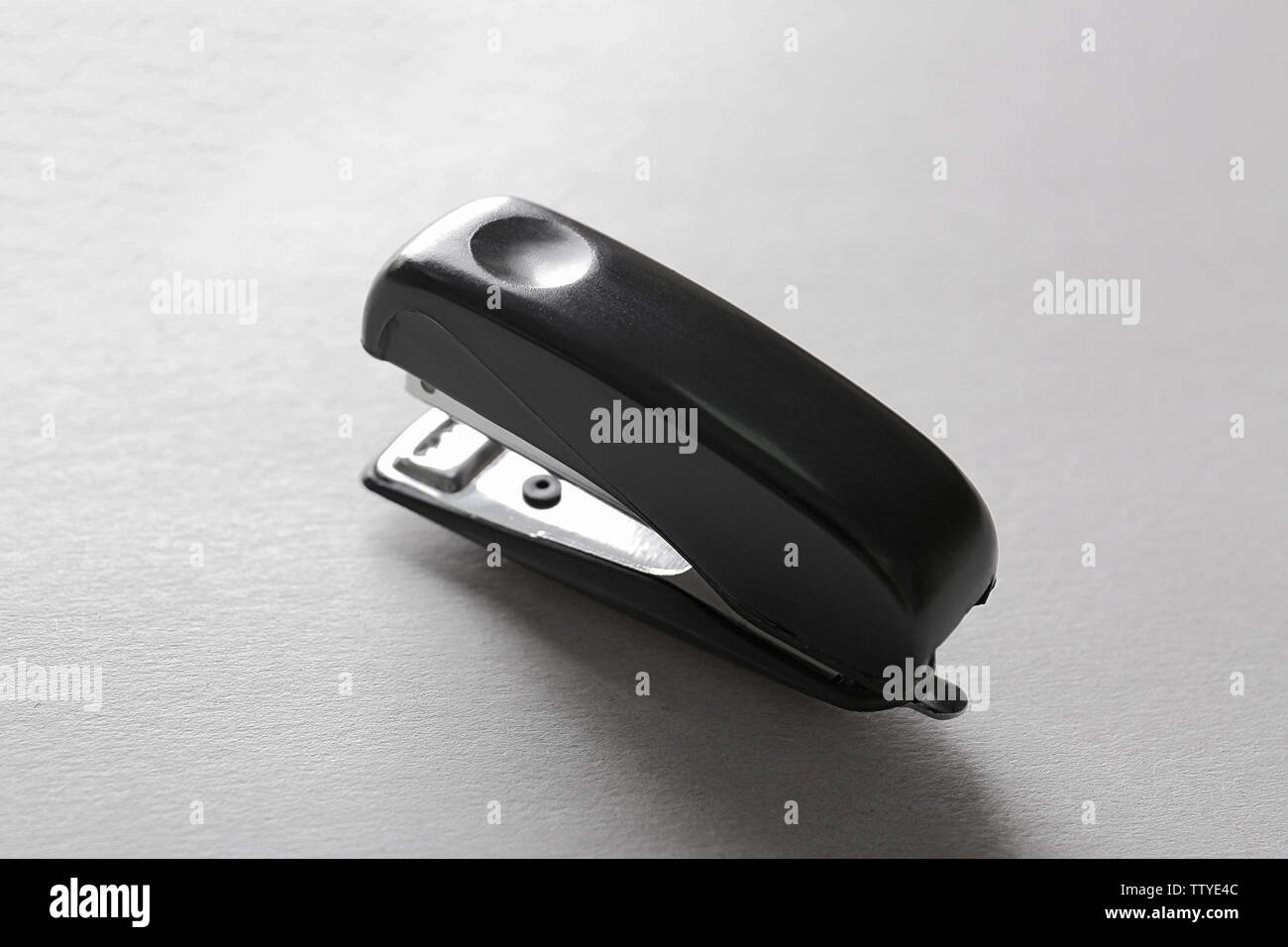 Black stapler on light background Stock Photo - Alamy