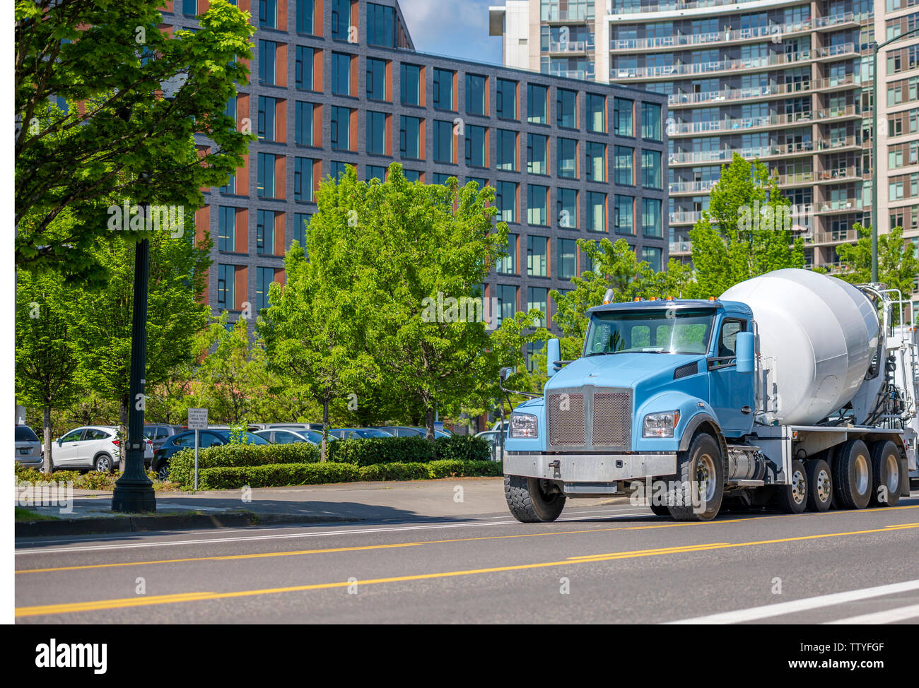 Blue big rig day cab semi truck for local deliveries with mixer tank ...