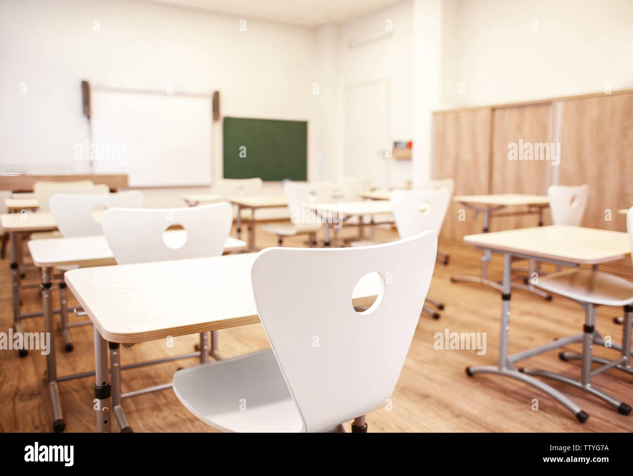 Empty classroom with chairs and desks Stock Photo - Alamy