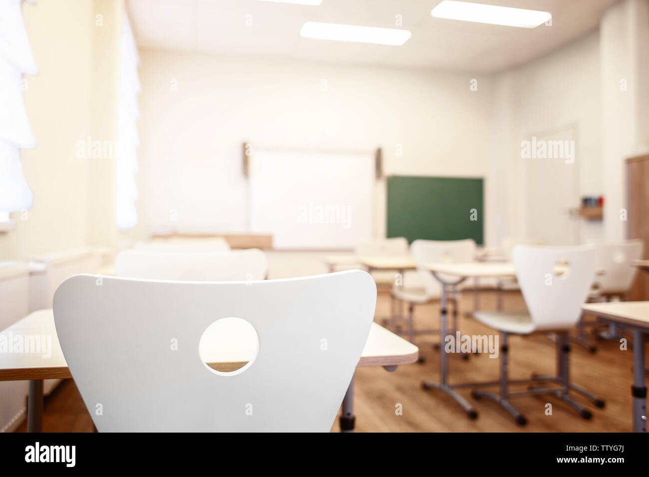Empty classroom with chairs and desks Stock Photo - Alamy