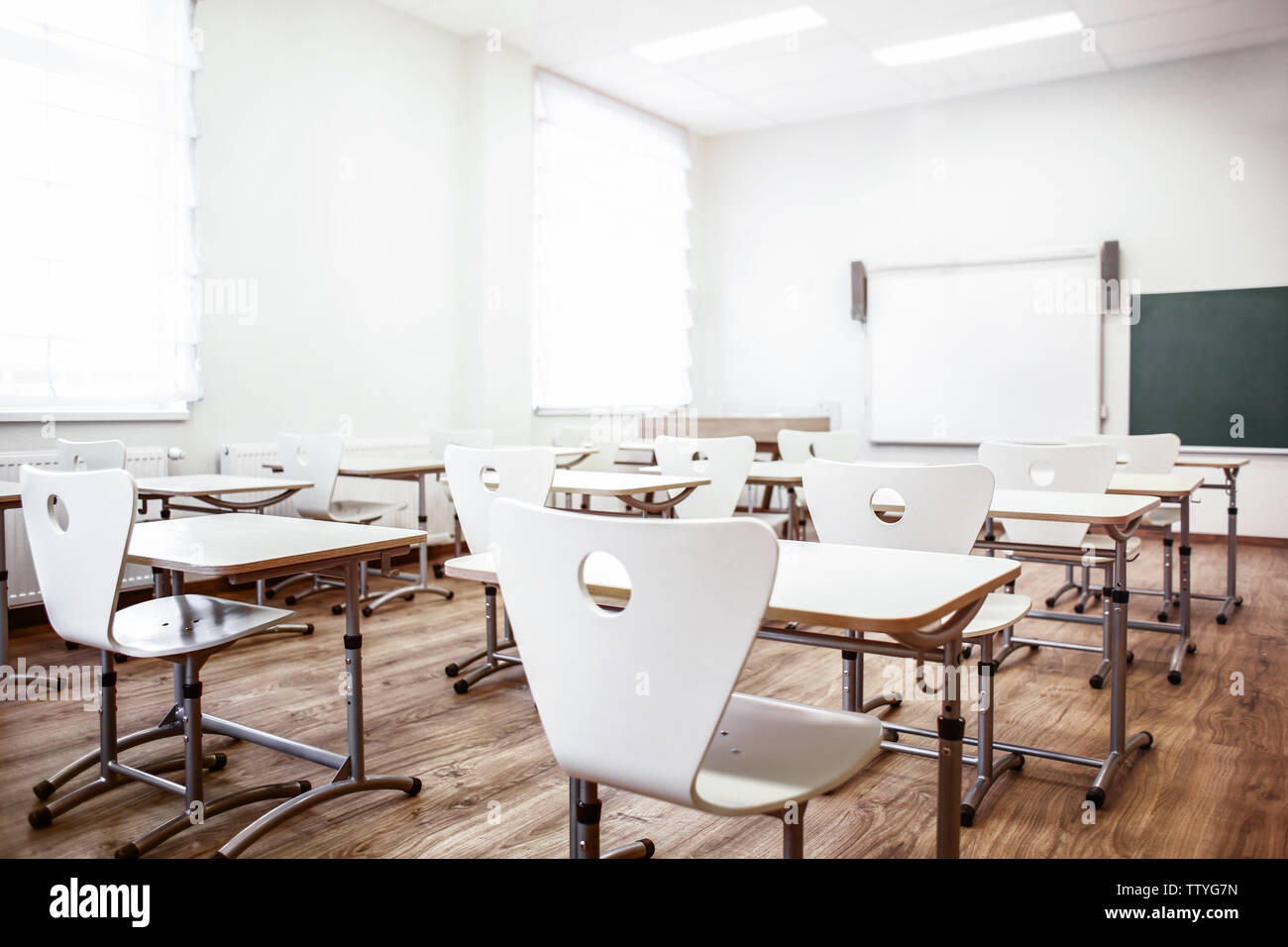 Empty classroom with chairs and desks Stock Photo - Alamy
