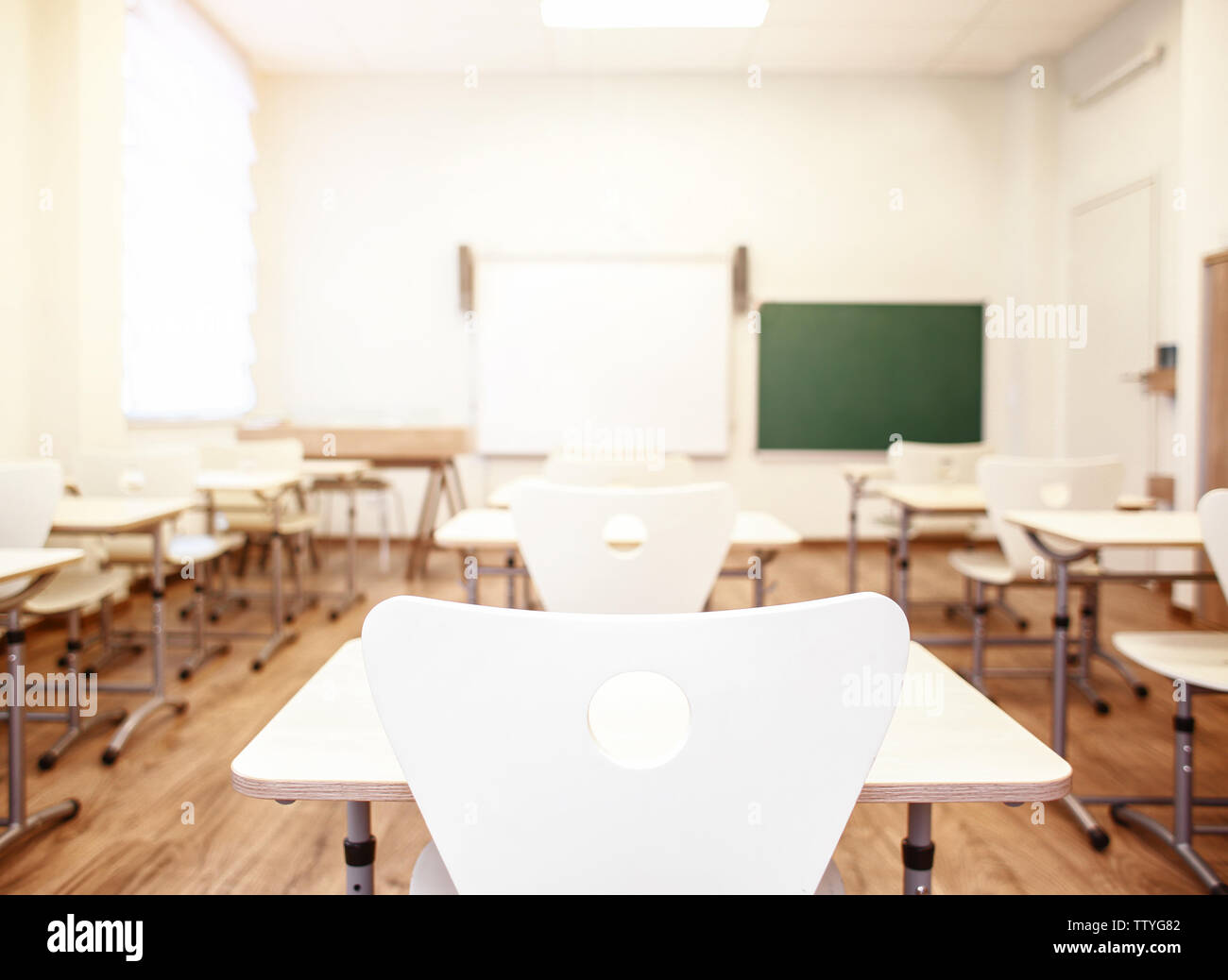 Empty classroom with chairs and desks Stock Photo - Alamy