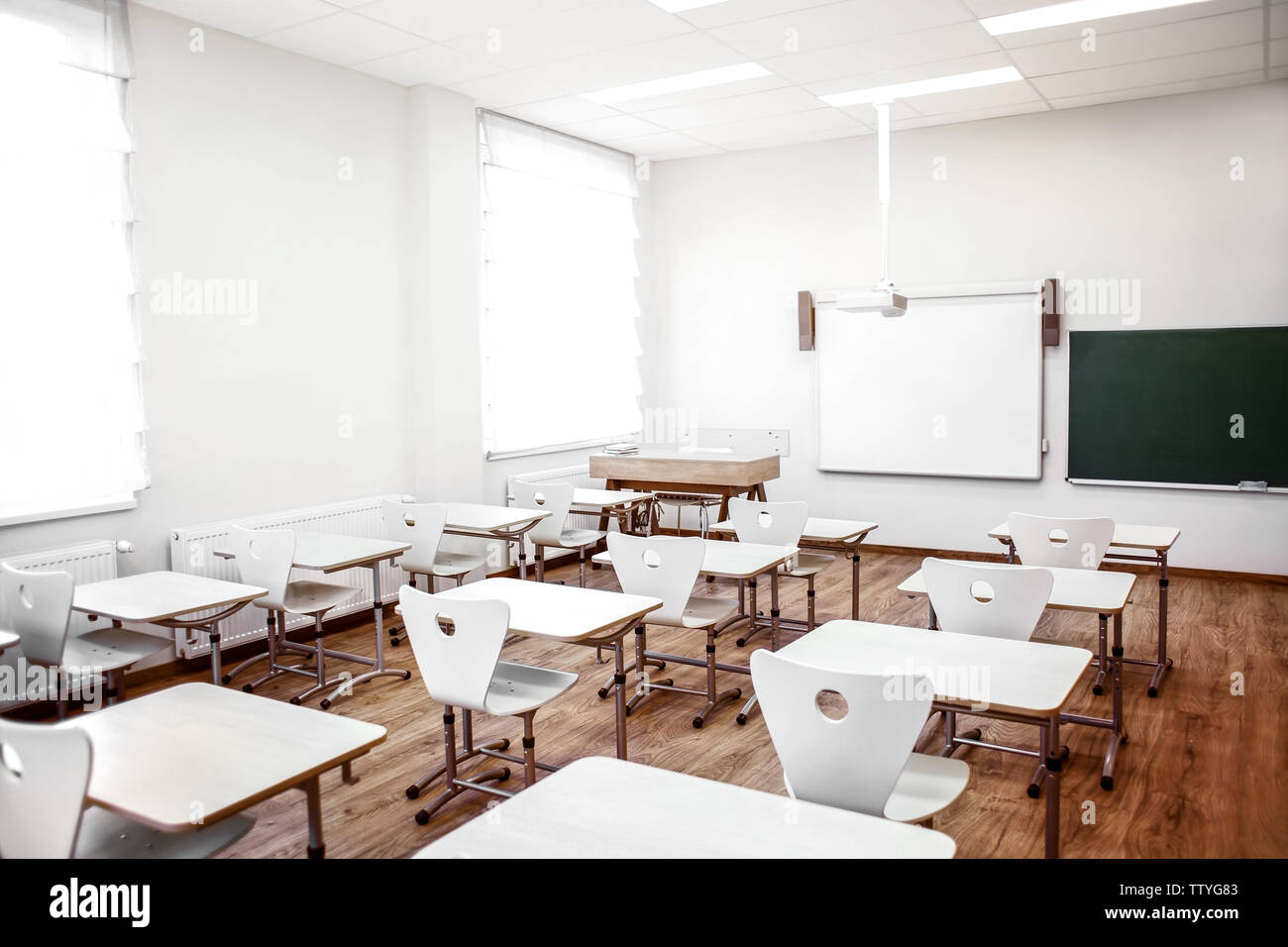 Empty classroom with chairs and desks Stock Photo - Alamy