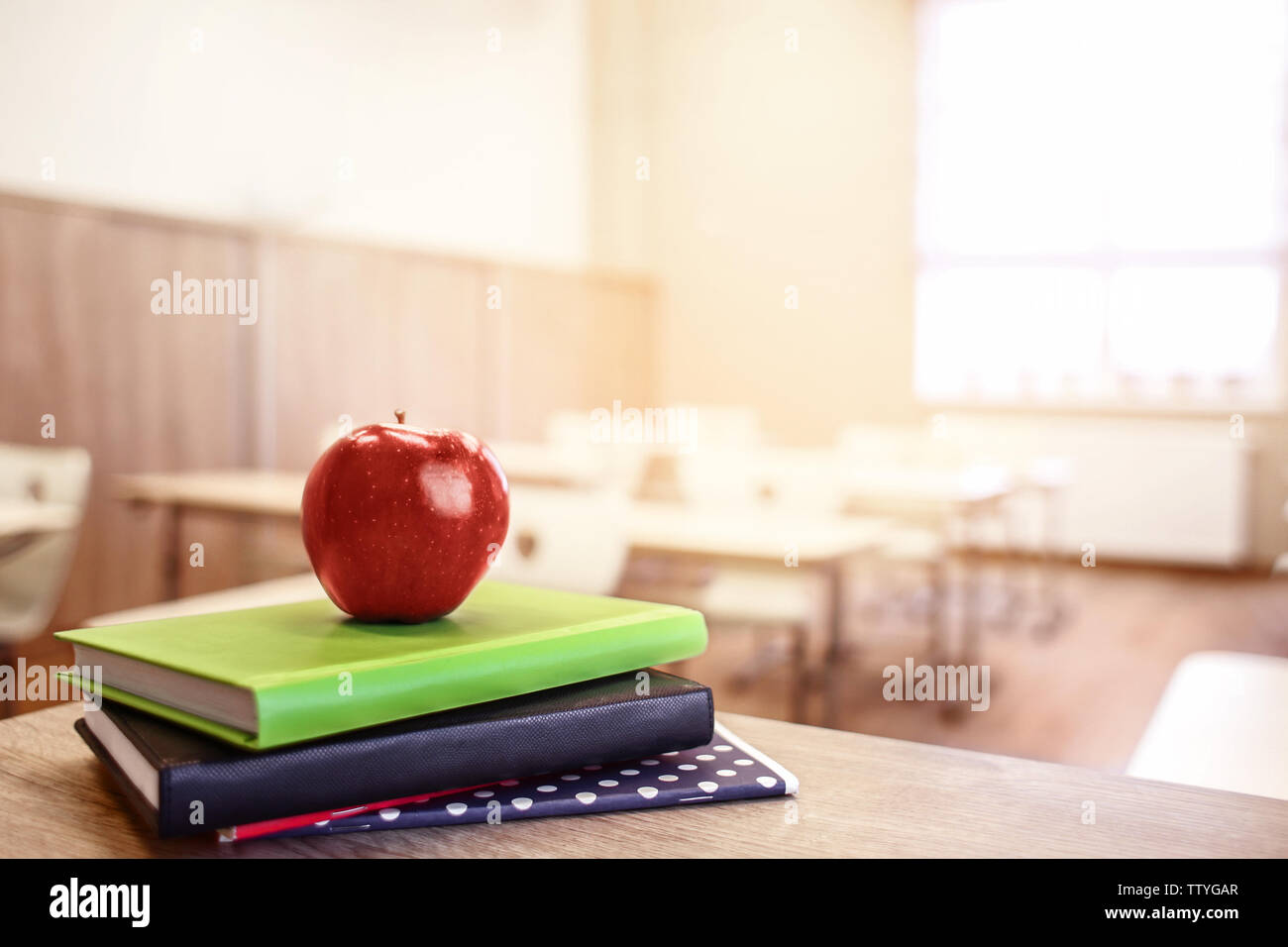 School teachers desk books apple hi-res stock photography and images ...