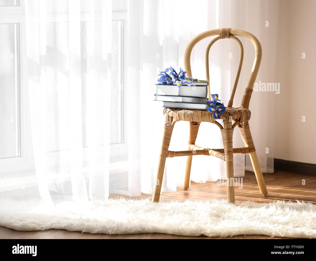 New books on chair indoors Stock Photo - Alamy