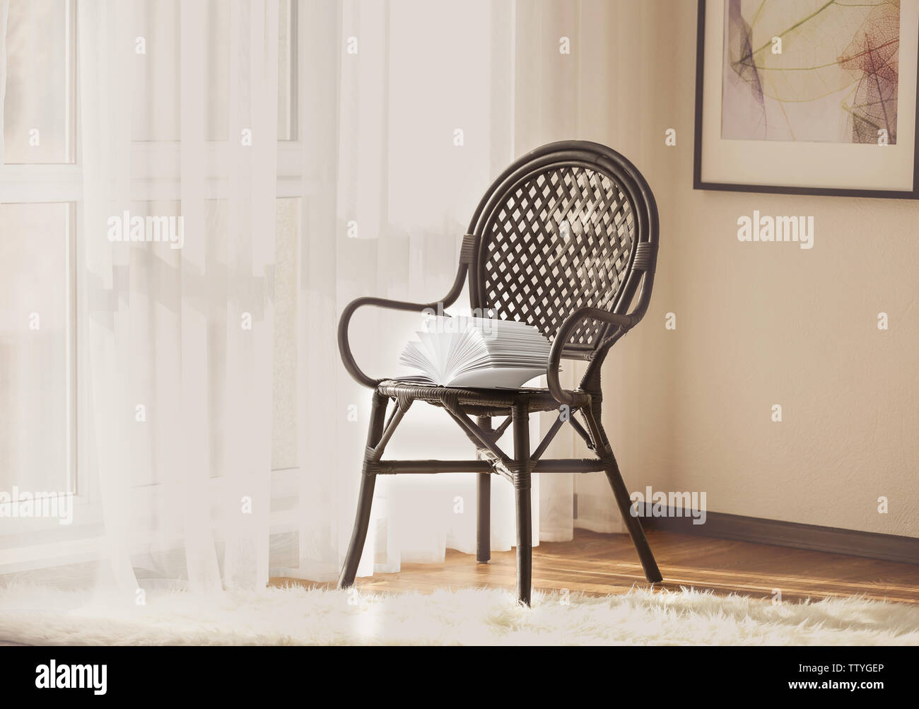 New book on chair indoors Stock Photo - Alamy