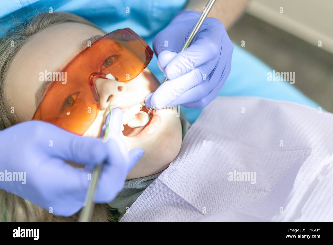Dental clinic. Reception, examination of the patient. Teeth care. Young ...