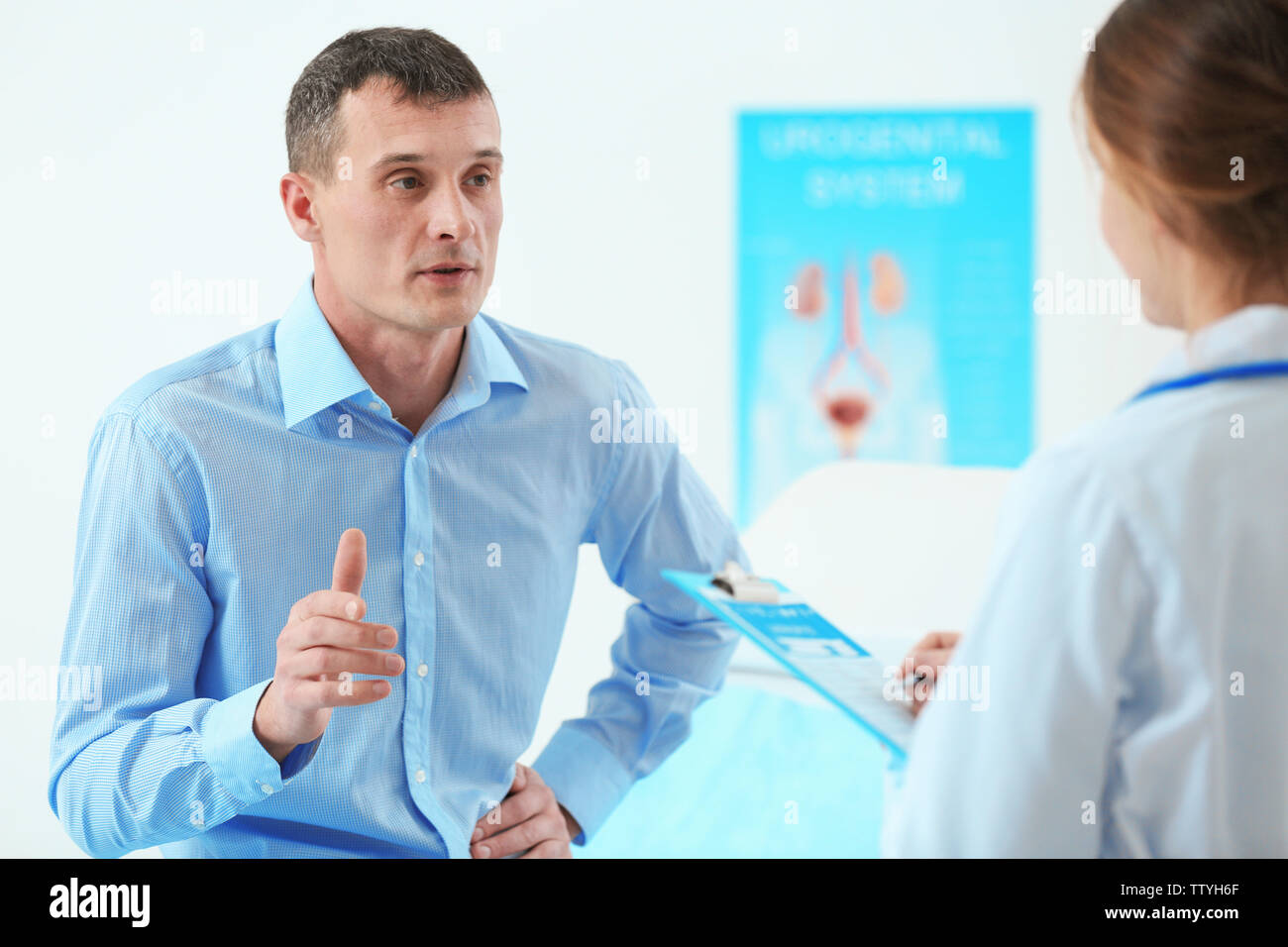 Patient talking with doctor at hospital Stock Photo - Alamy