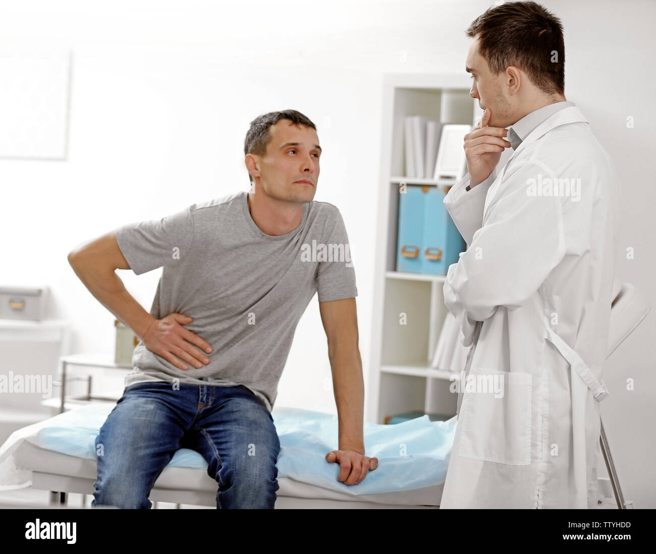 Patient talking with doctor at hospital Stock Photo - Alamy