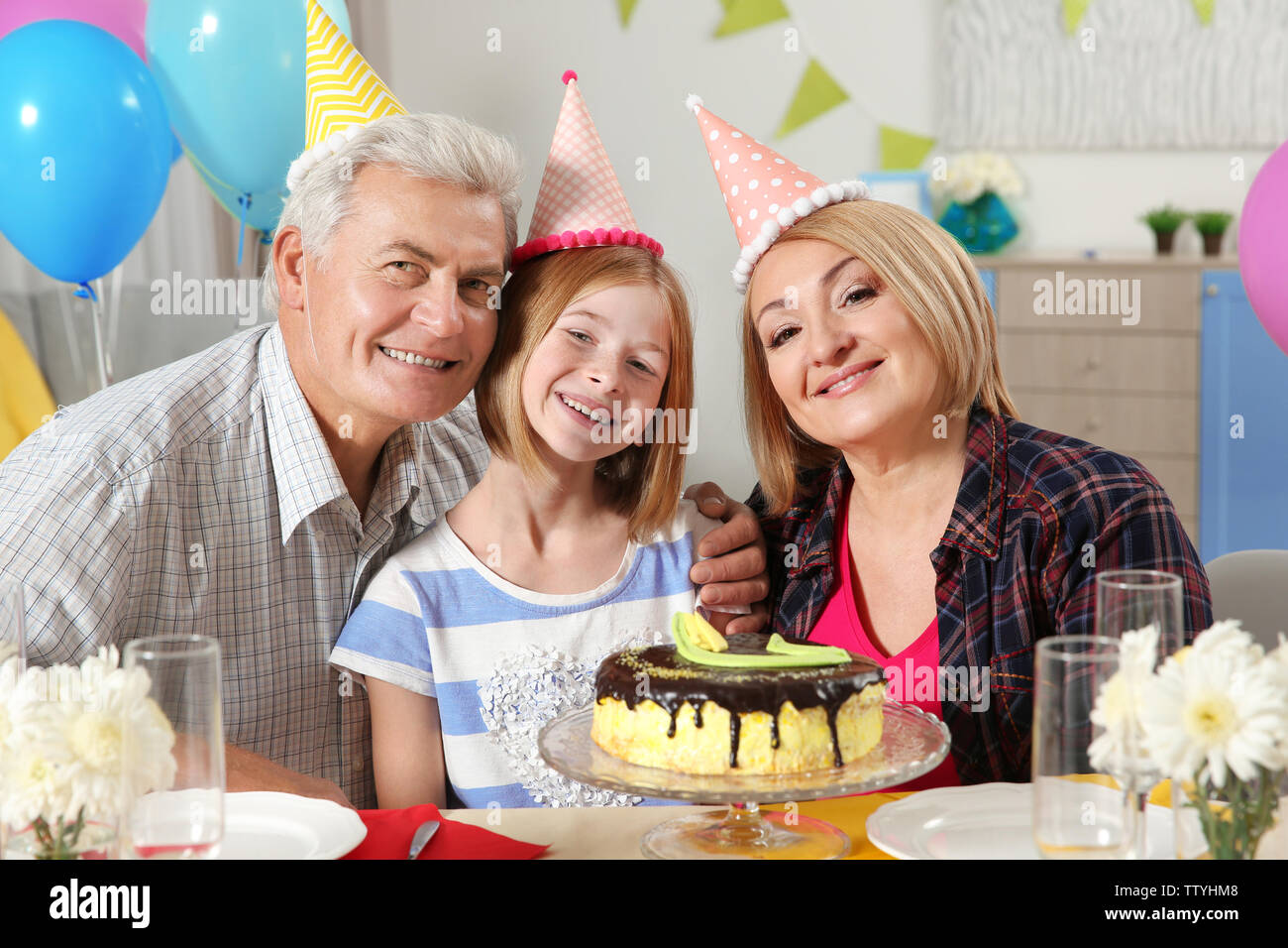 Man sitting table balloons hi-res stock photography and images - Alamy