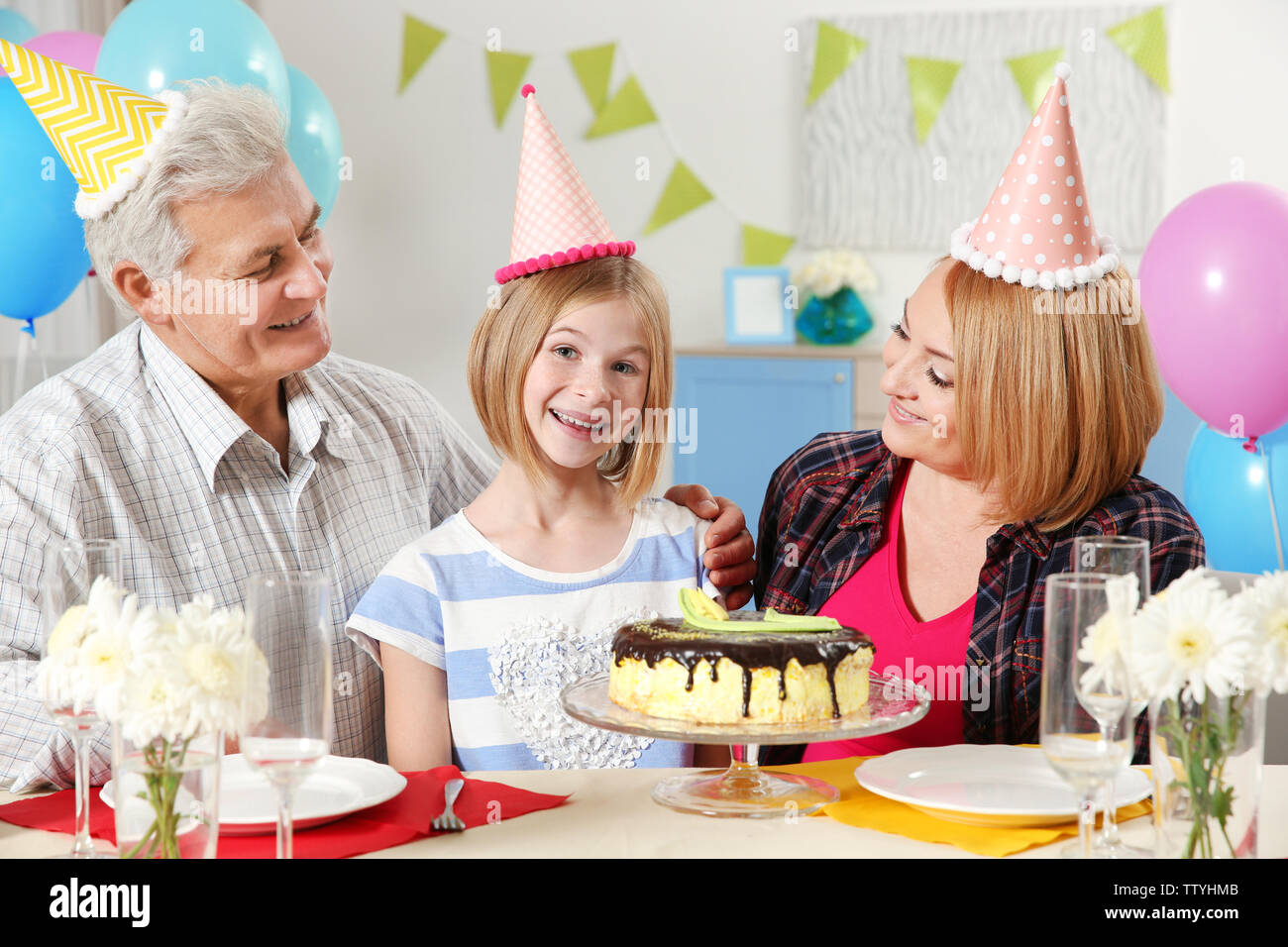 Man sitting table balloons hi-res stock photography and images - Alamy