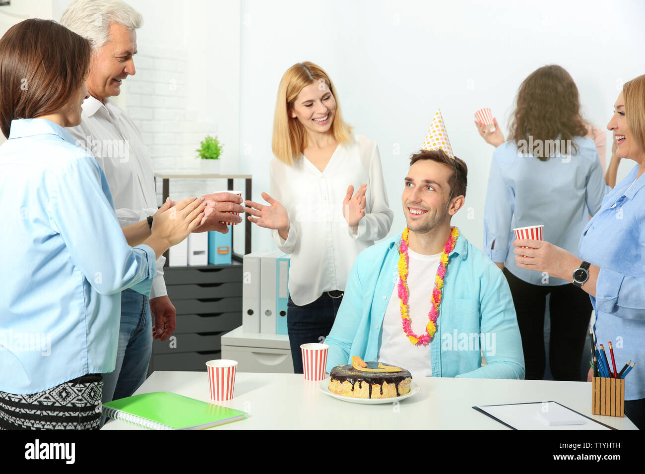 Birthday celebrating in office Stock Photo - Alamy