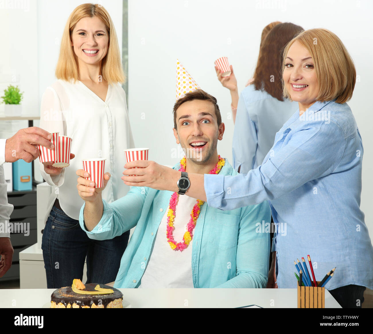 Birthday celebrating in office Stock Photo - Alamy
