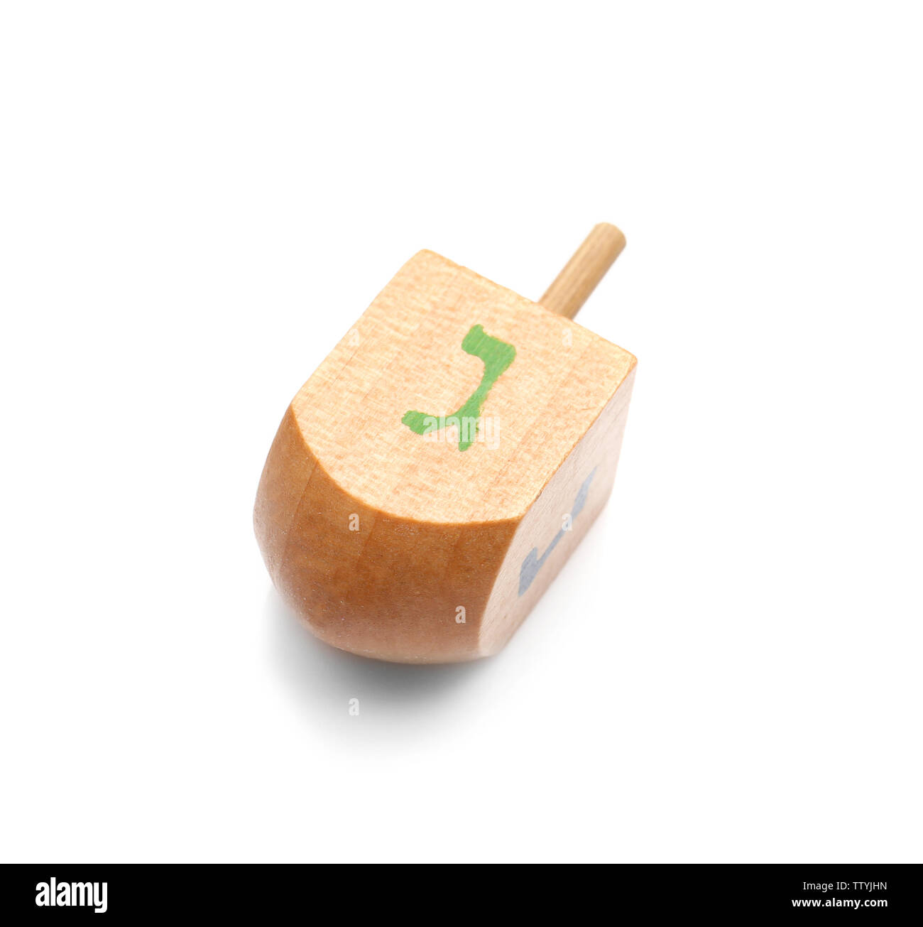 Wooden dreidel for Hanukkah on white background Stock Photo - Alamy