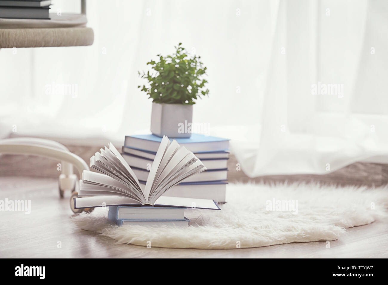 Pile of books on the floor at home Stock Photo - Alamy