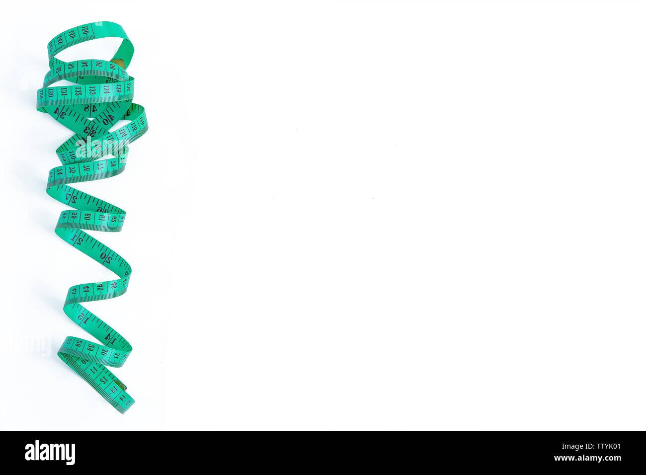 Green measuring tape isolated on white background Stock Photo - Alamy