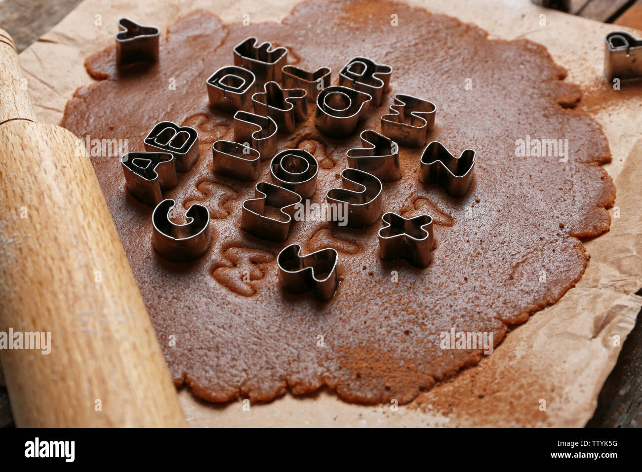 Chocolate cookie alphabet preparation process Stock Photo - Alamy