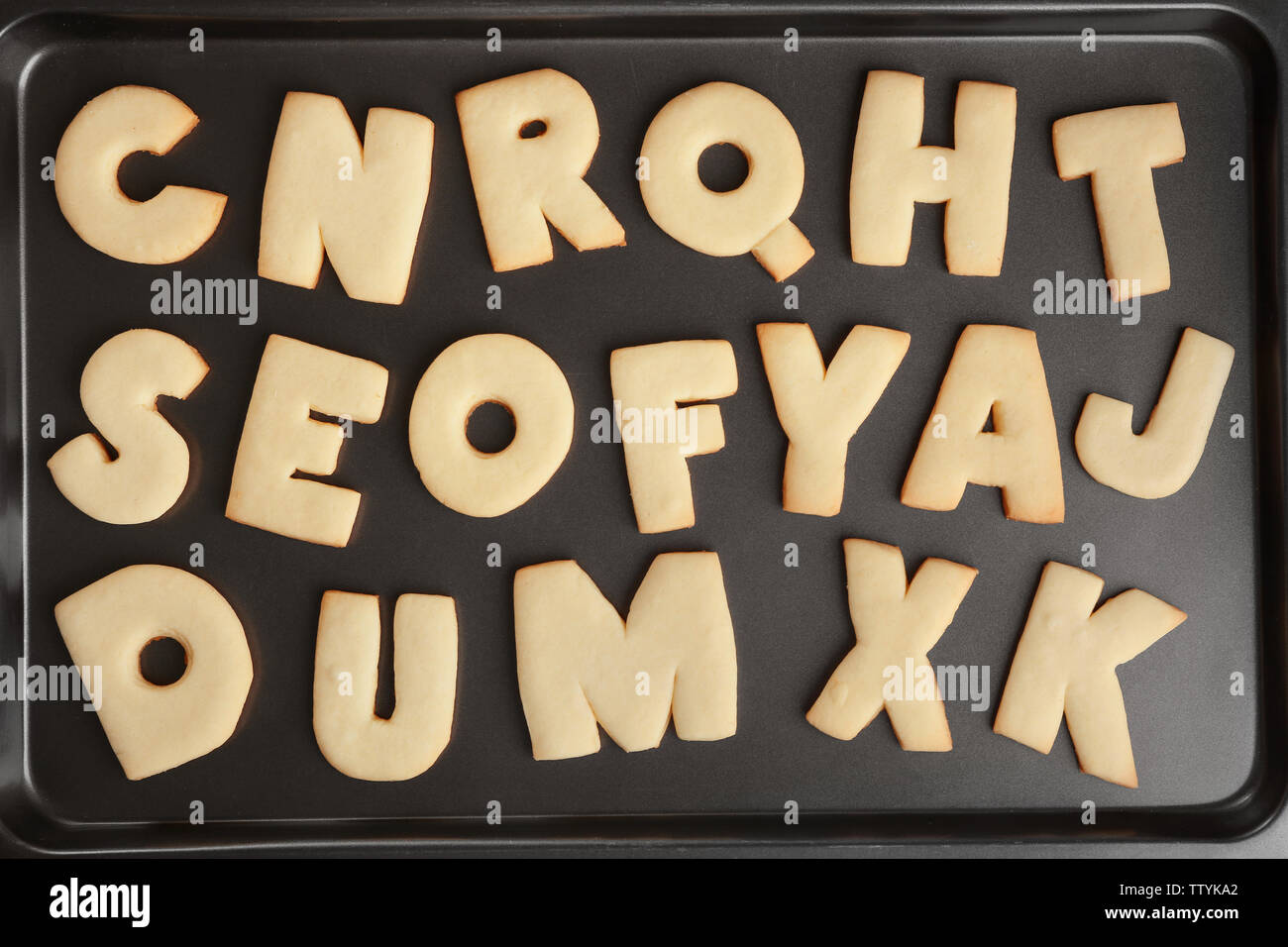 Cookie alphabet on baking tray, closeup Stock Photo - Alamy
