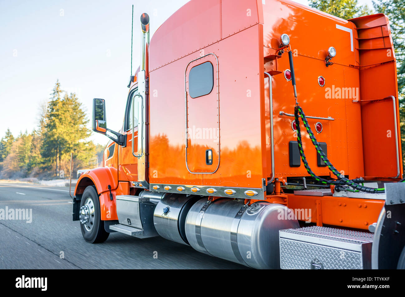 Bright orange classic iconic American big rig long haul professional ...