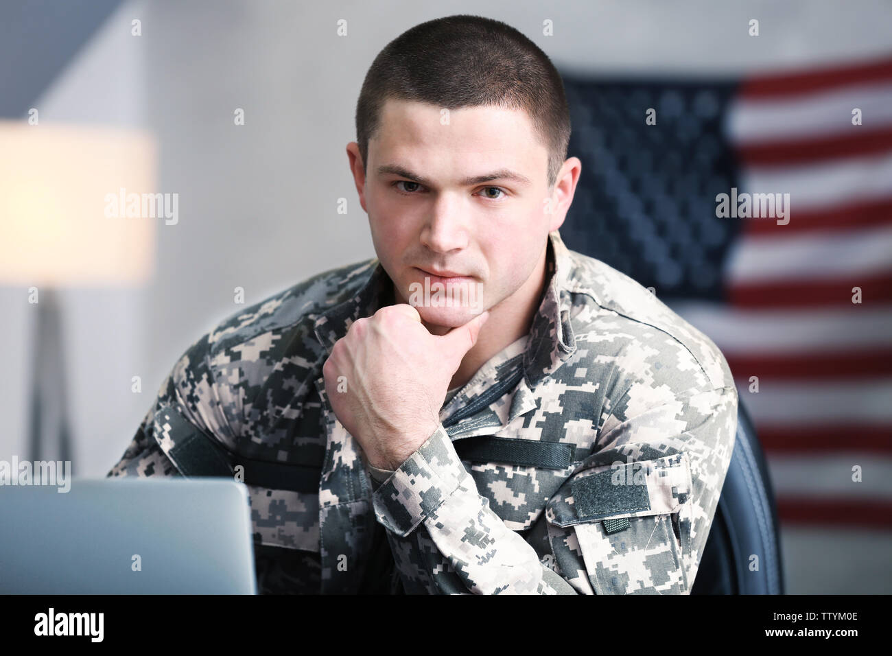 Male soldier sitting in chair hi-res stock photography and images - Alamy