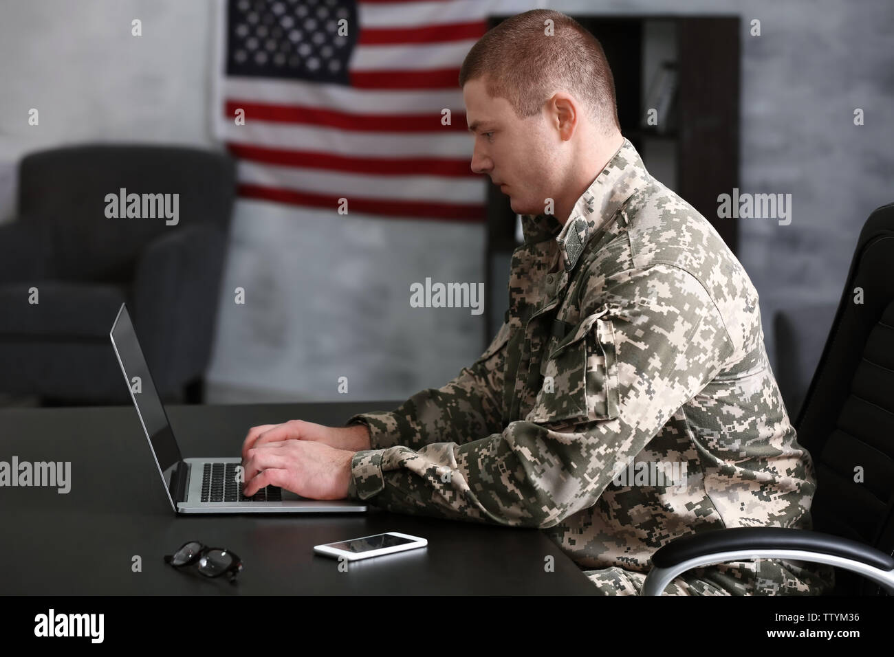 Male soldier sitting in chair hi-res stock photography and images - Alamy