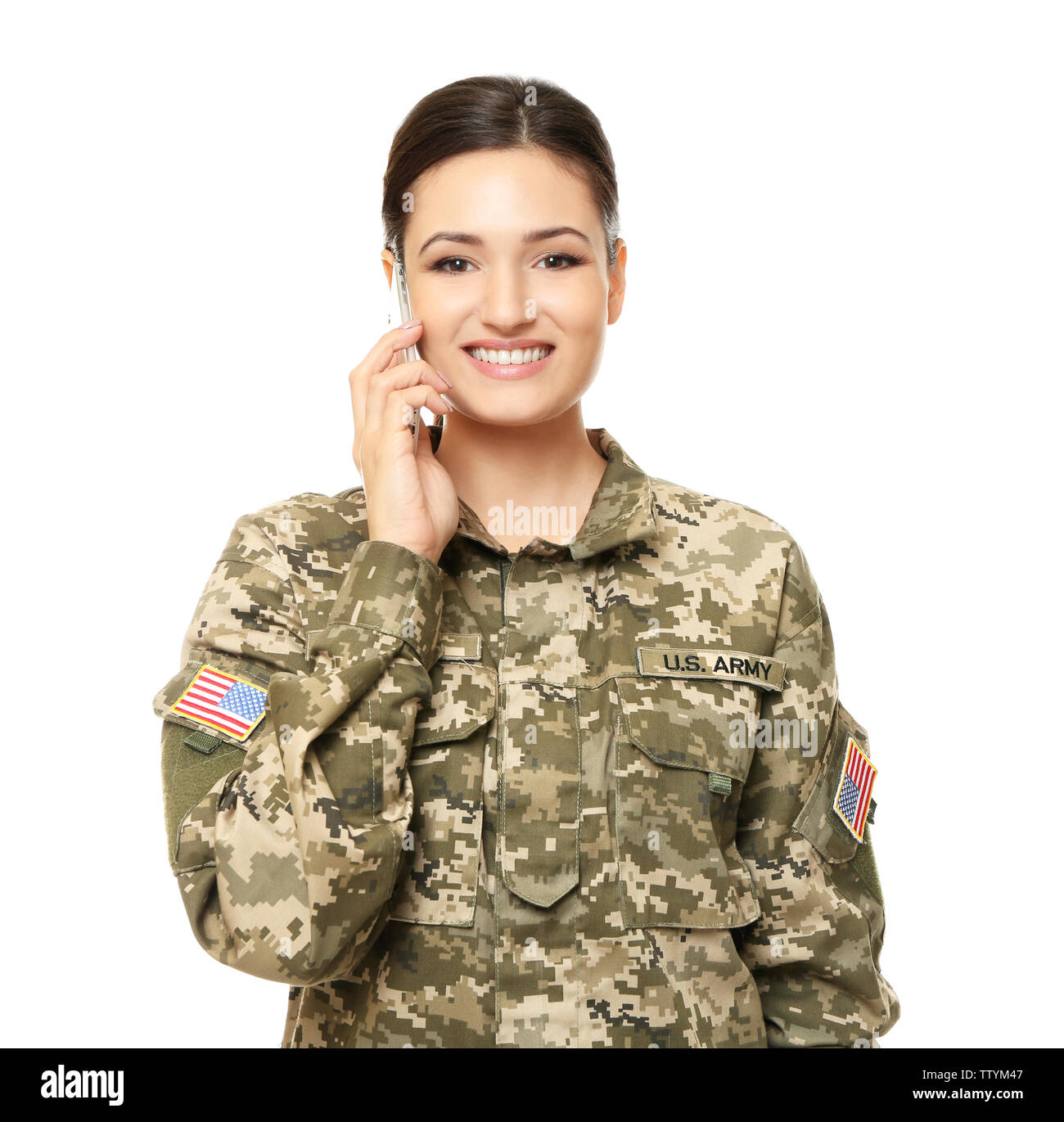 Pretty female soldier talking by mobile phone on white background Stock ...