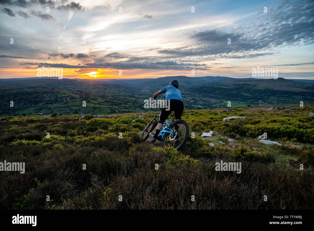 A man rides an ebike from the summit of The Blorenge in the Brecon ...