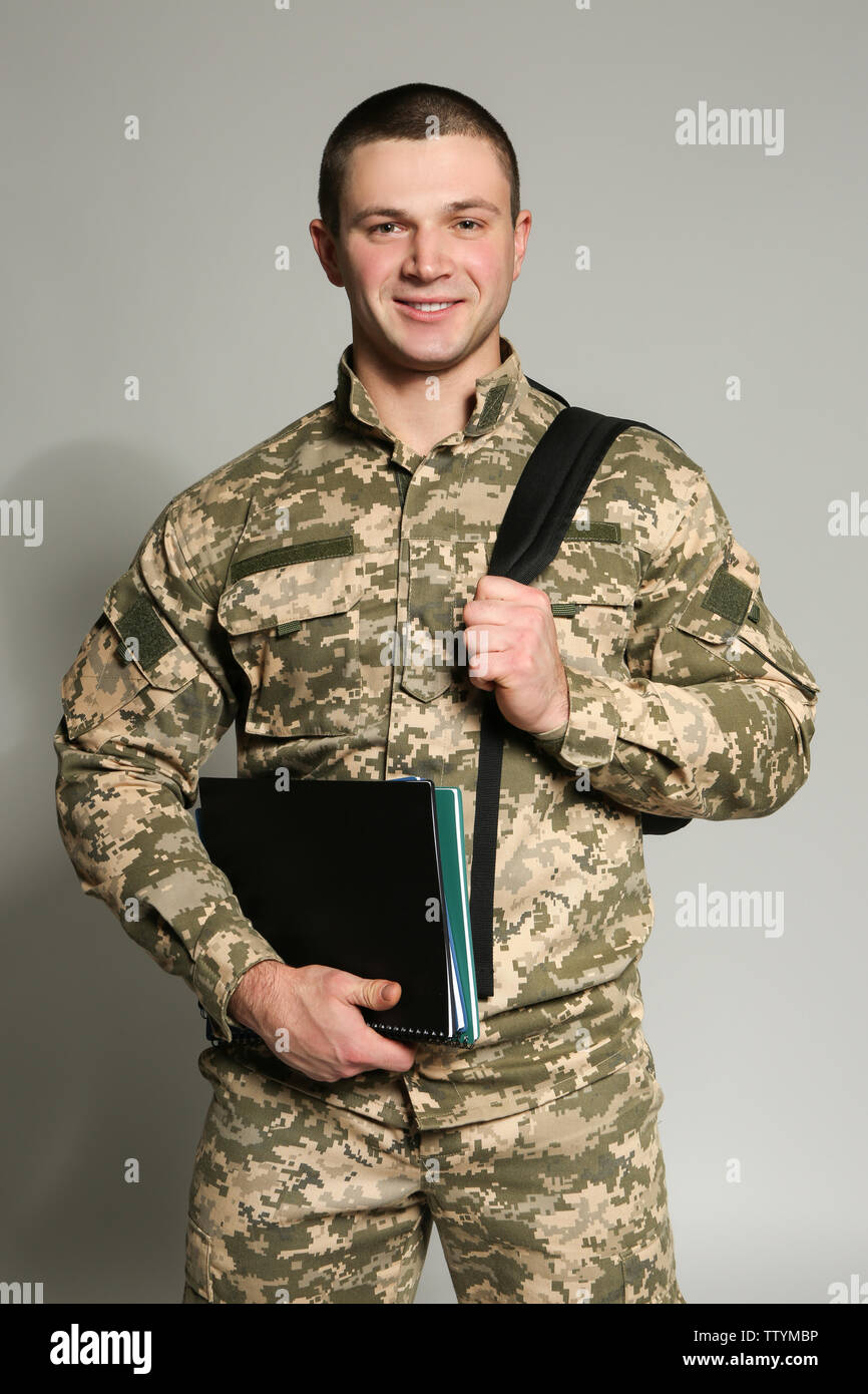 Cadet of military school on grey background Stock Photo - Alamy