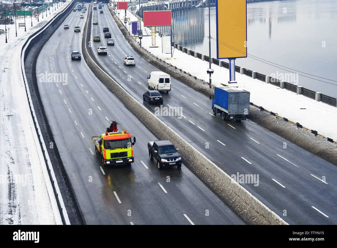 View of city road with cars in winter Stock Photo - Alamy