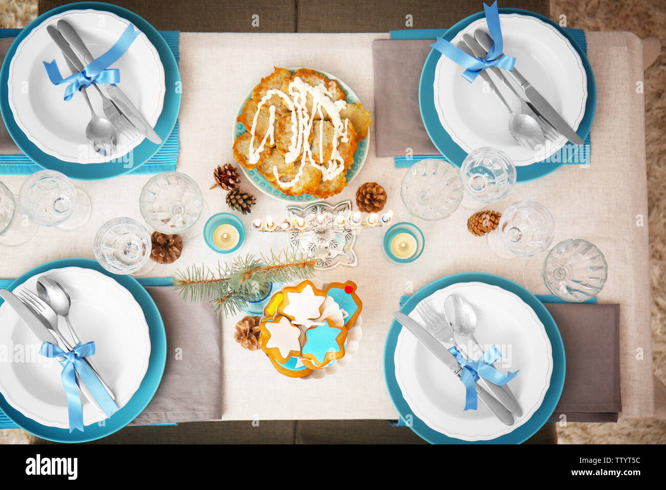 Beautiful table setting with menorah for Hanukkah Stock Photo - Alamy