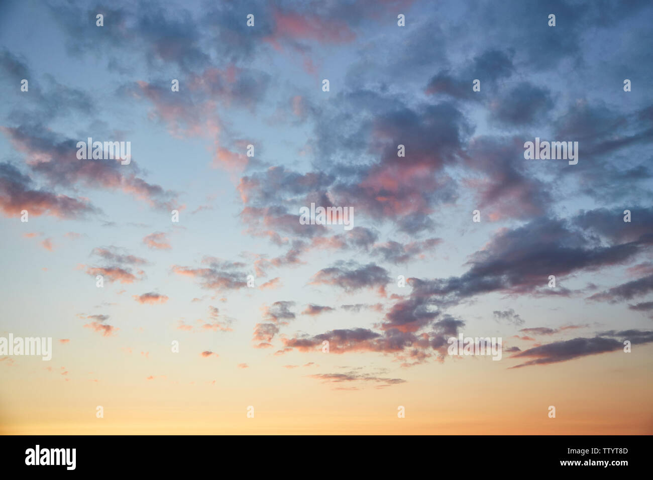 The sky with clouds backlit by the setting sun Stock Photo - Alamy