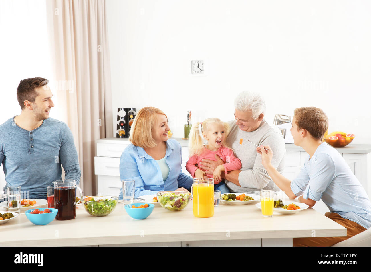 Father feeding son having hi-res stock photography and images - Alamy