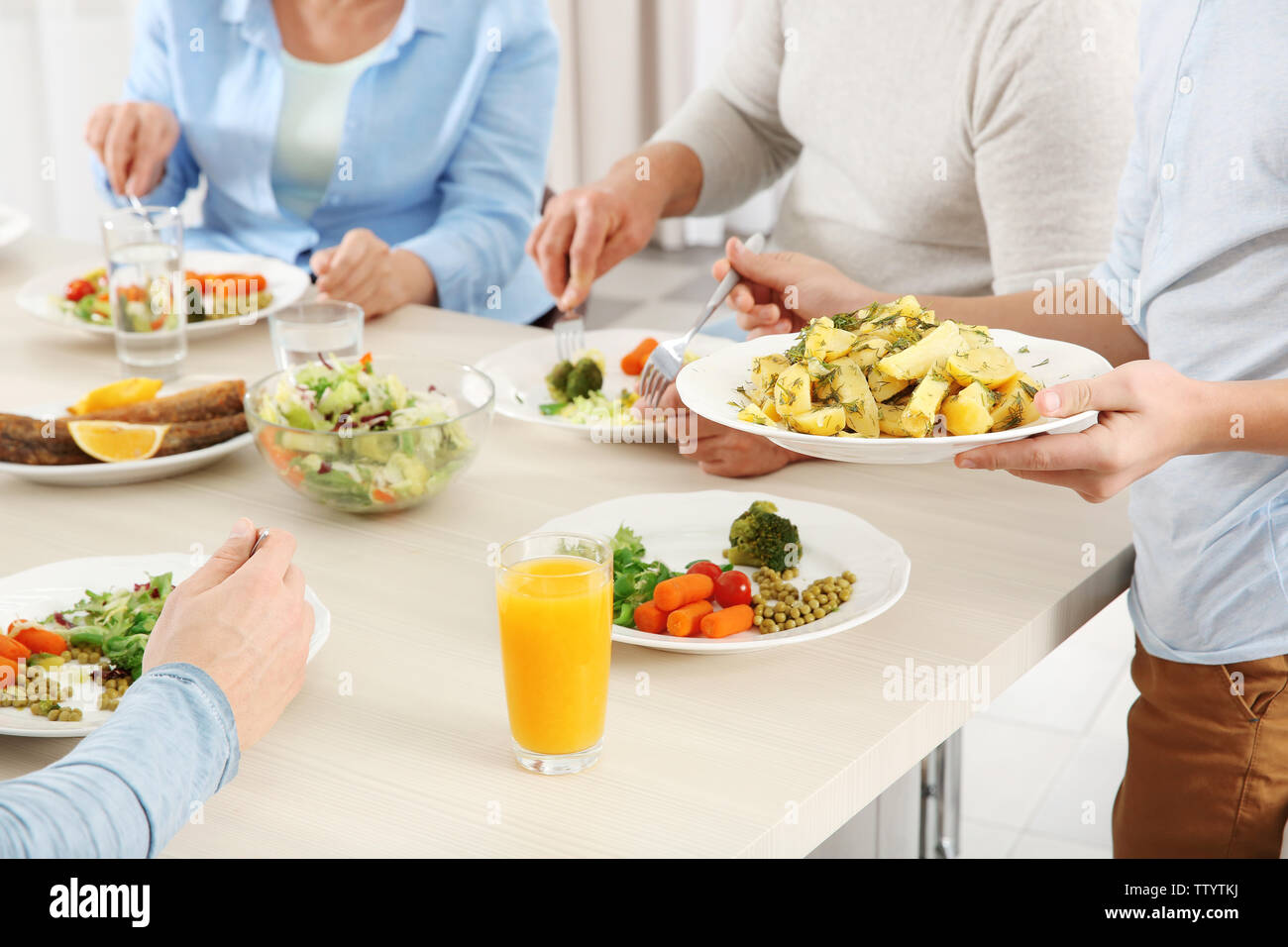 Closeup woman eating boiled broccoli hi-res stock photography and ...