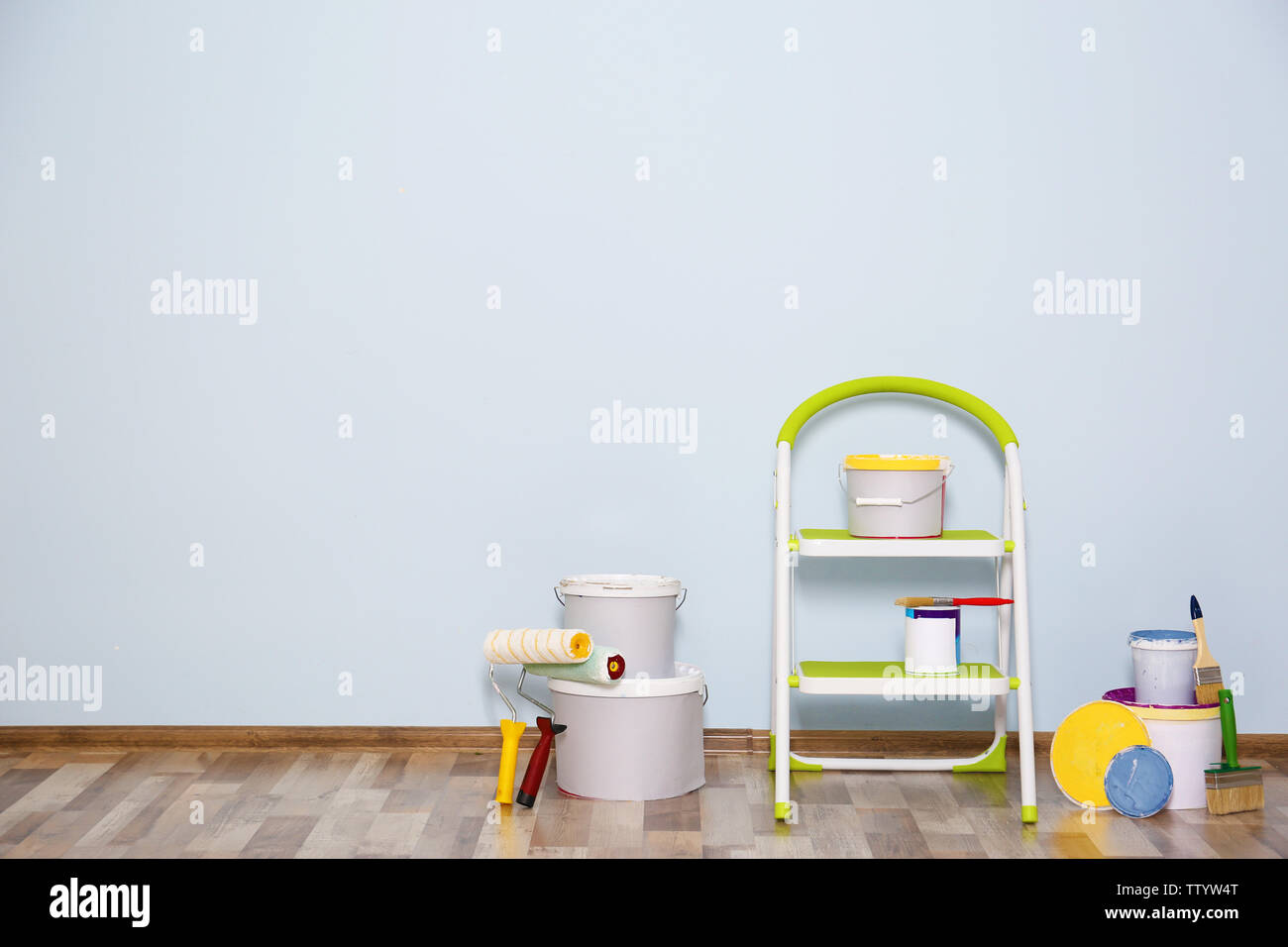 Set for wall painting in empty room Stock Photo - Alamy