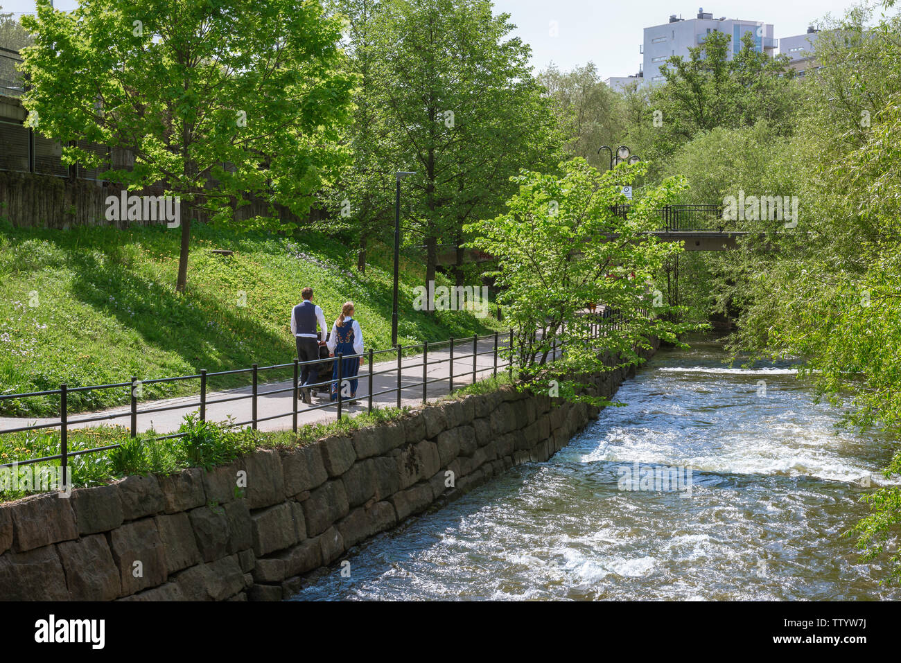 Akerselva River Oslo, view of two Norwegian people in traditional ...