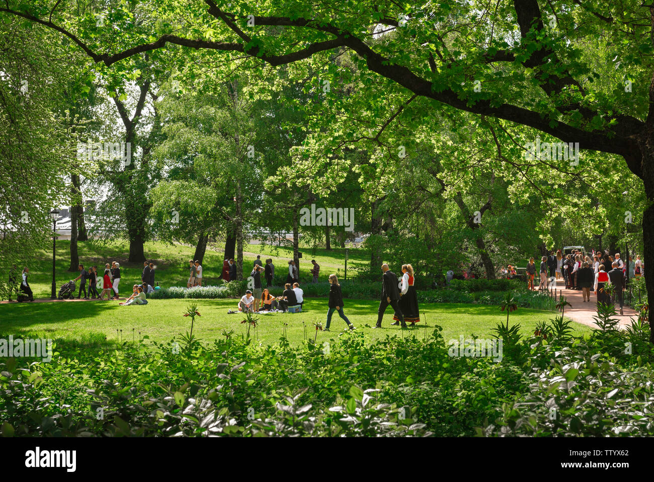 Oslo park, view in late spring of Norwegian people relaxing in the ...