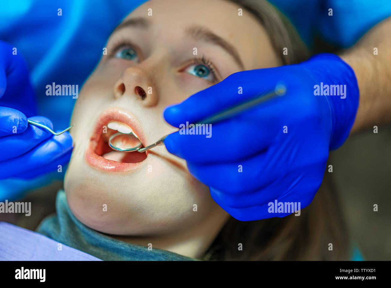 Dental clinic. Reception, examination of the patient. Teeth care. Young ...